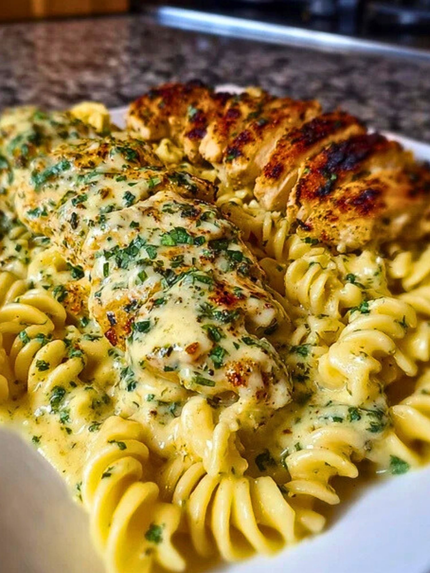 Cheesy Twisted Pasta with Creamy Garlic Parmesan Chicken
